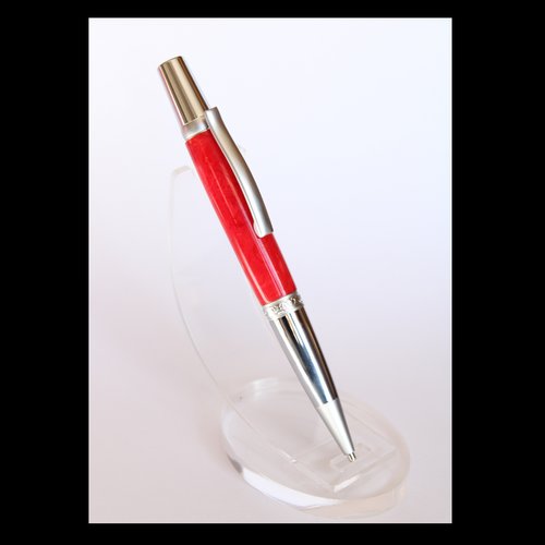 Stylo rotatif "sierra" réalisé en résine rouge - Un grand marché